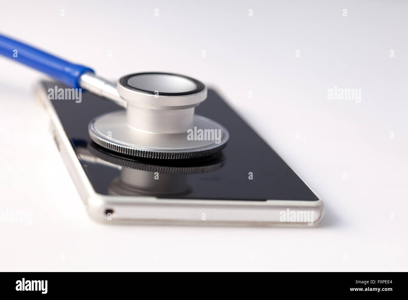 Smartphone being diagnosed by stethoscope - phone repair and check up ...