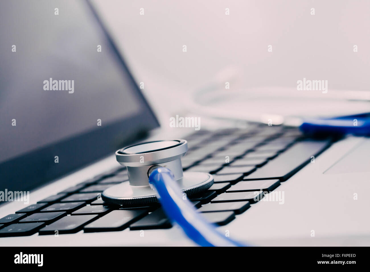Stethoscope on laptop - Computer repair and maintenance concept - in ...