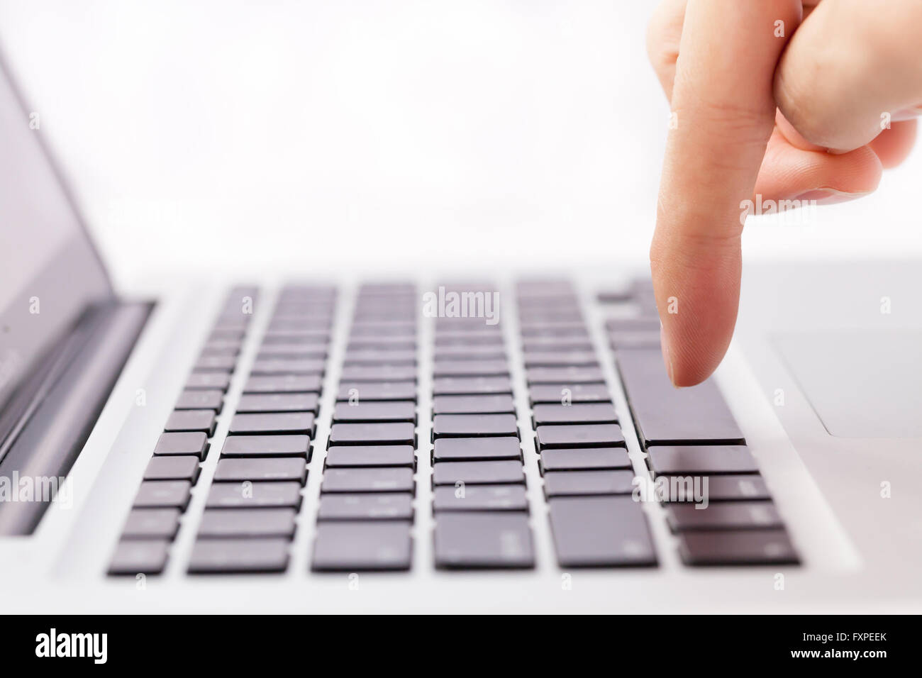 Human hands going to press a button on keypad in white isolated ...