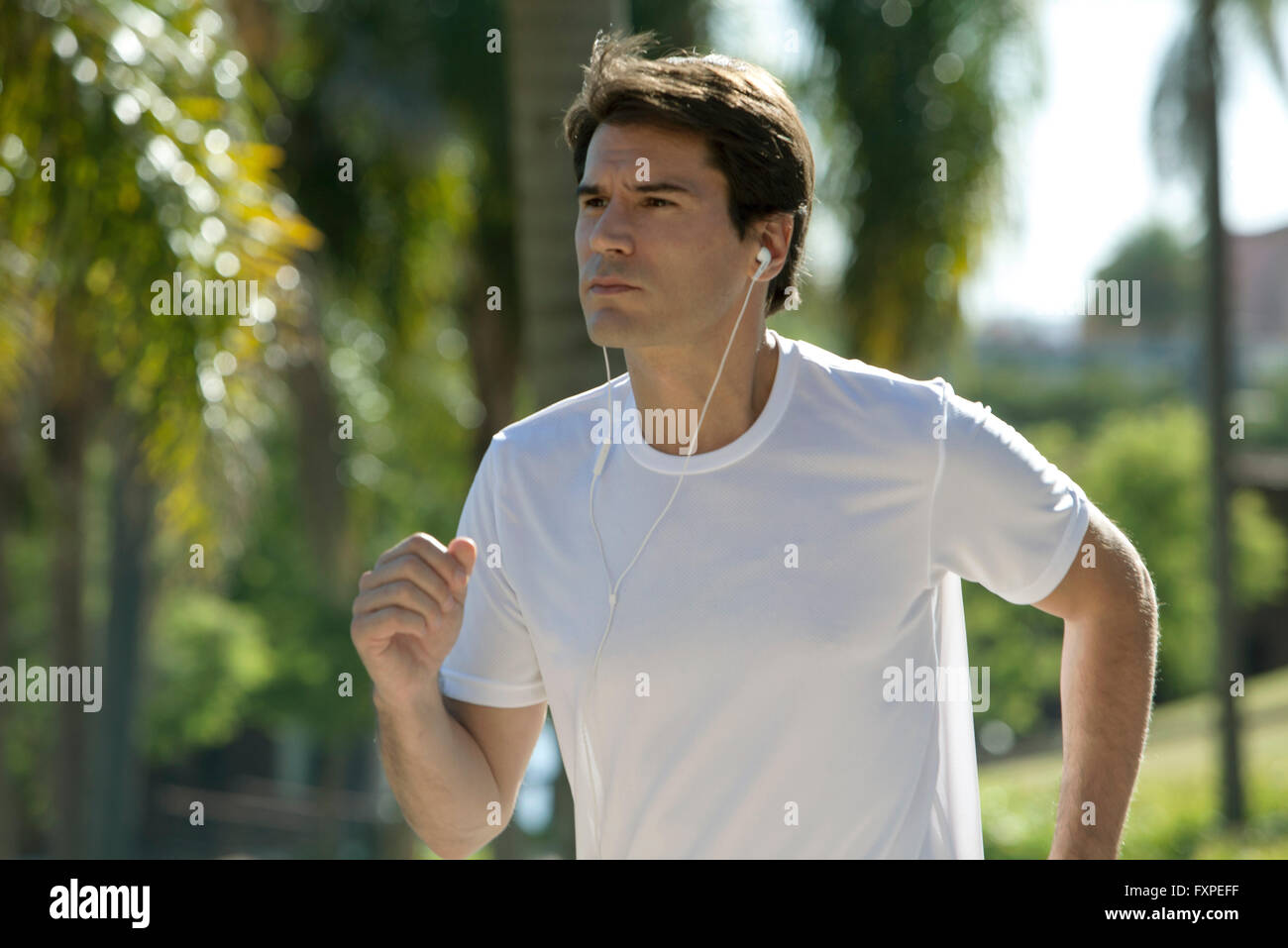 Man running in park Stock Photo - Alamy