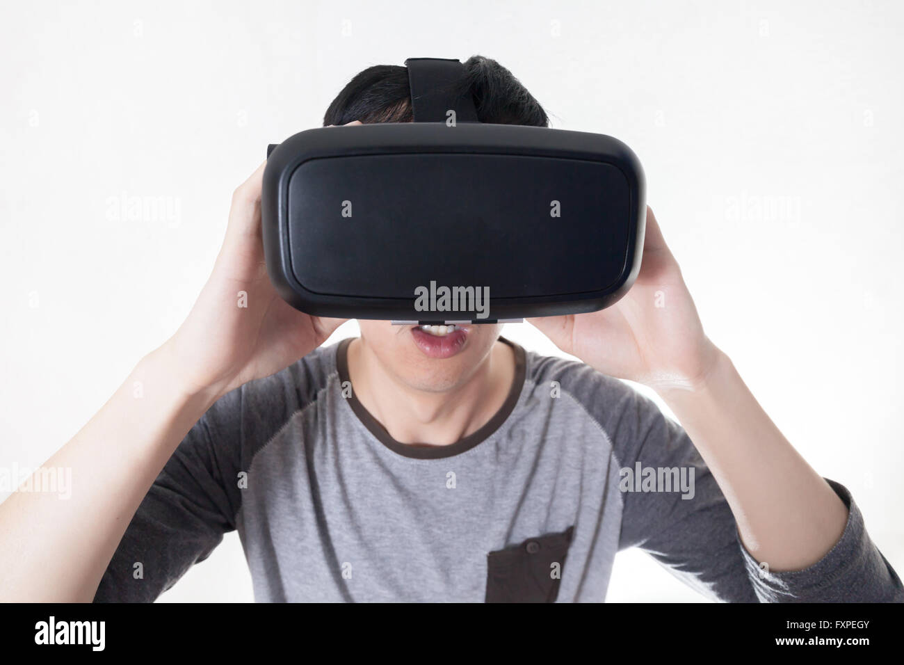 Asian man wearing vr goggle hi-res stock photography and images - Alamy