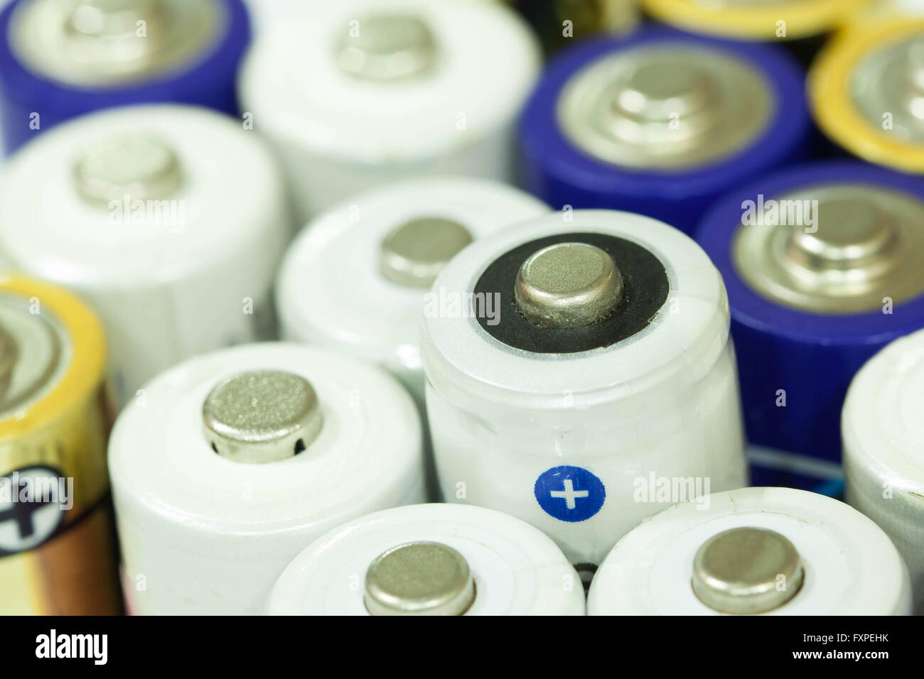 Pile of colorful batteries stacked in a row together Stock Photo - Alamy