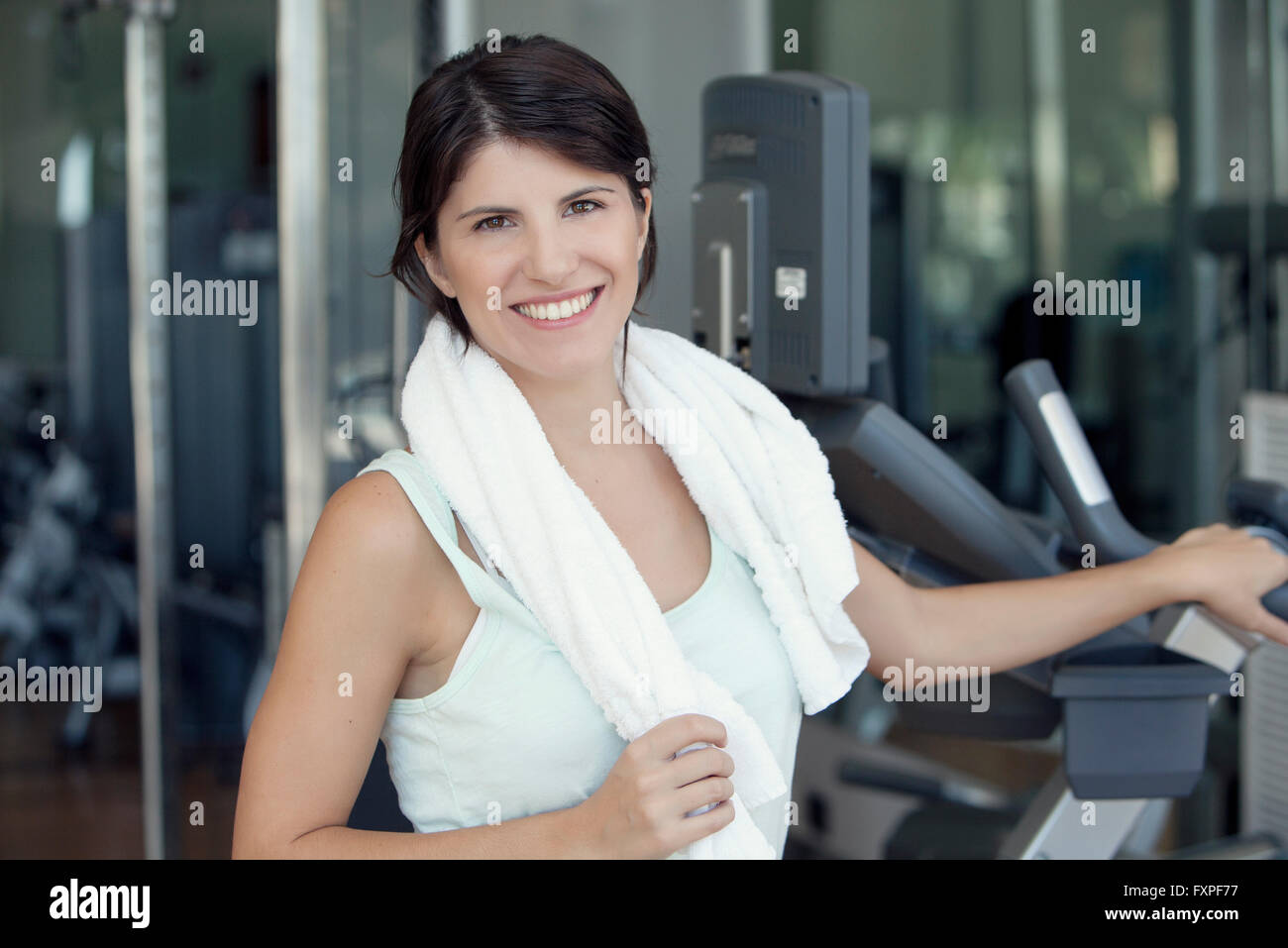 Woman smiling after workout in fitness club, portrait Stock Photo - Alamy