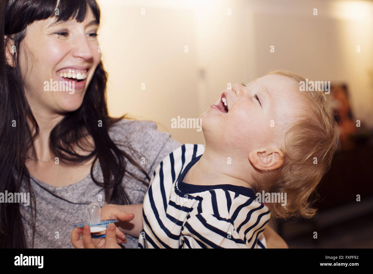 Mother and toddler sharing laugh Stock Photo - Alamy