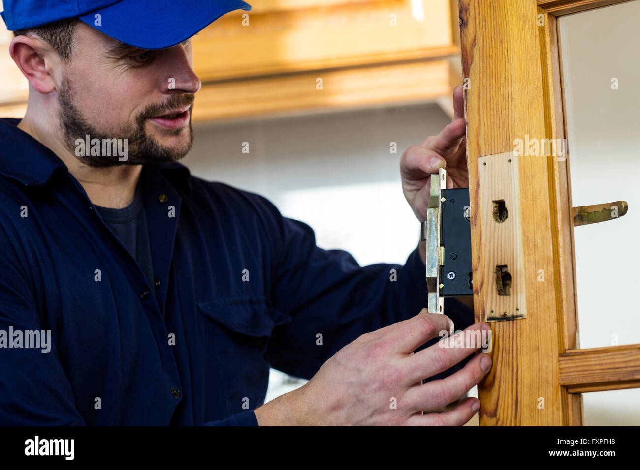 Man repairing door hi-res stock photography and images - Alamy