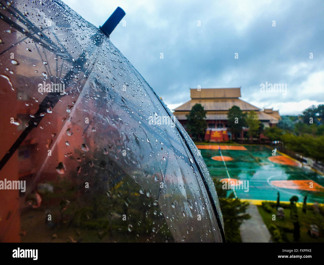 Rain drops falling from umbrella hi-res stock photography and images ...
