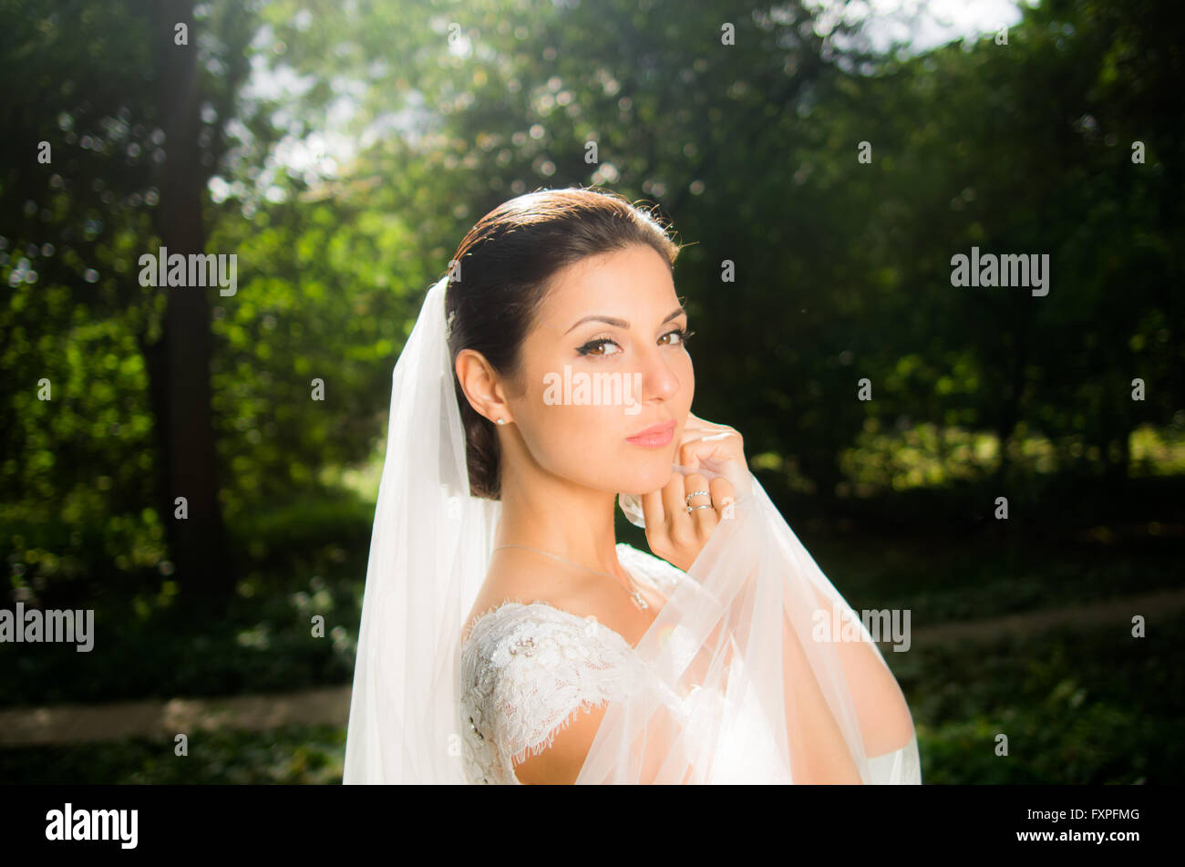 Portrait of the bride in the garden in the backlight Stock Photo - Alamy