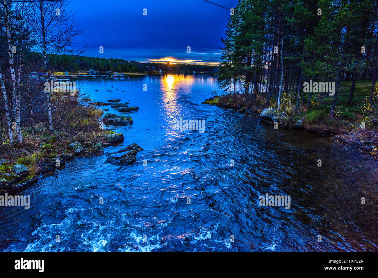 Sunset across Lake Inari at Nellim Stock Photo - Alamy