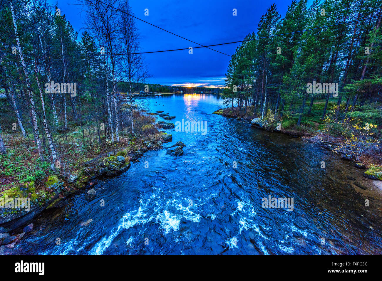 Sunset across Lake Inari at Nellim Stock Photo - Alamy