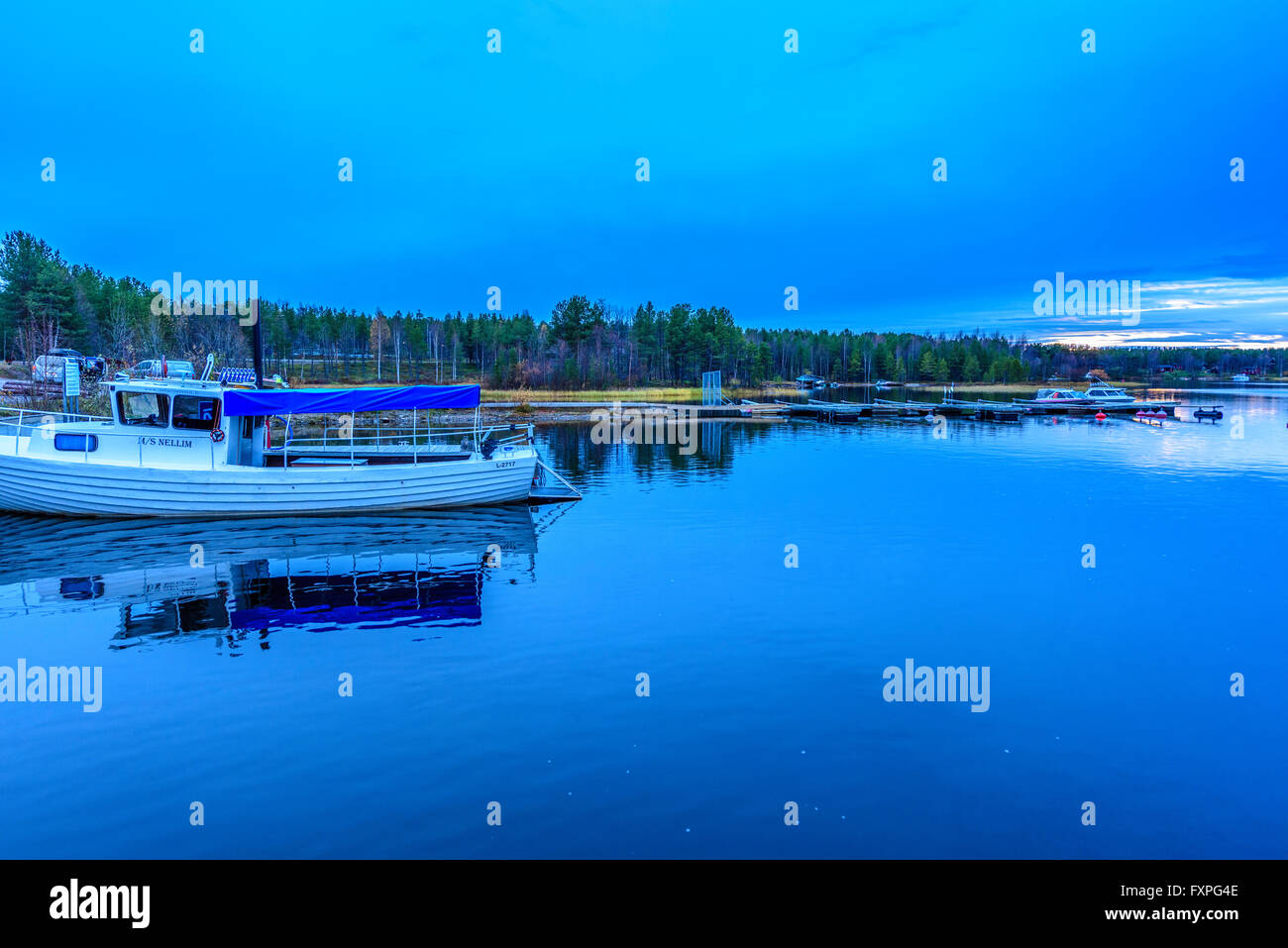 Sunset across Lake Inari at Nellim Stock Photo - Alamy