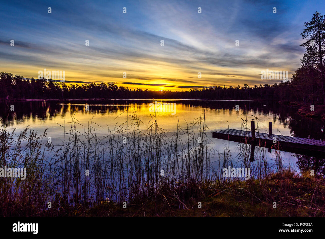 Sunrise on the lake at Nellim Wilderness Hotel Stock Photo - Alamy