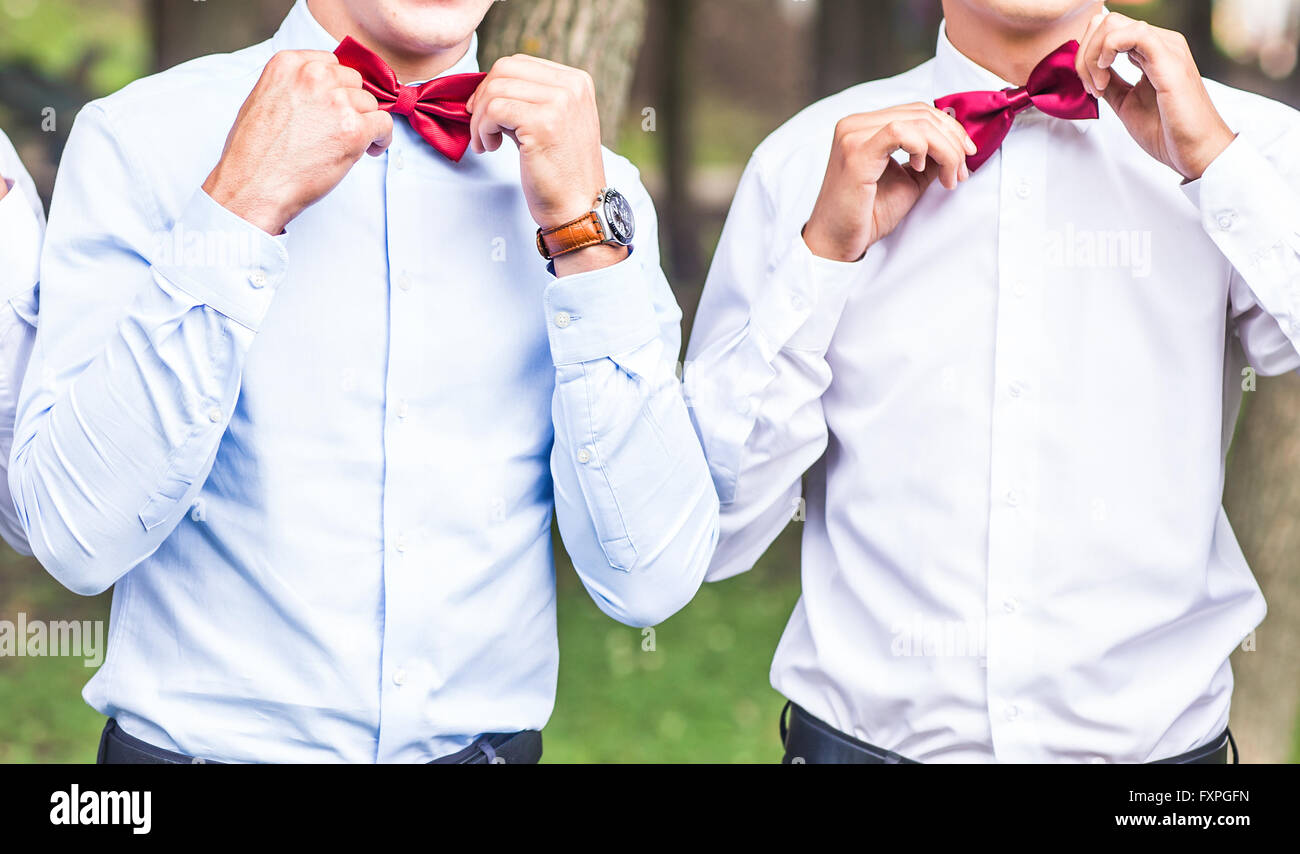 Group of young men with bow tie. Cheerful friends. friends outdoors ...