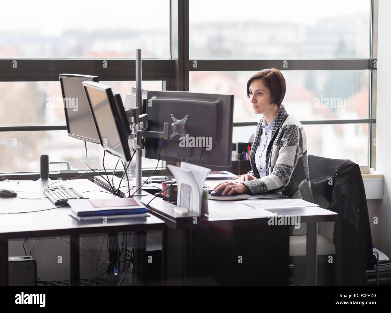 Business woman working in corporate office Stock Photo - Alamy
