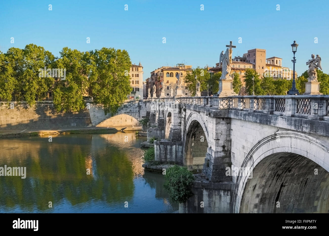Saint Angel Bridge at sunset Stock Photo - Alamy