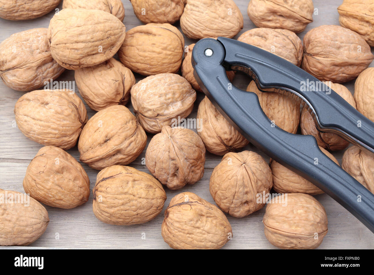 Metal nut cracker with walnuts hi-res stock photography and images - Alamy