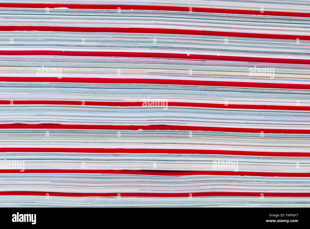 Stack of magazines with red cover Stock Photo - Alamy