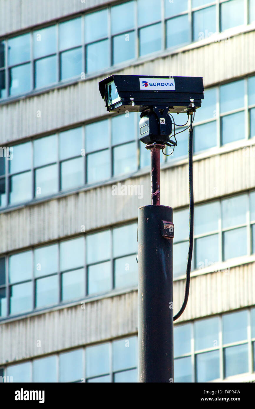 Black CCTV camera on tall post Stock Photo - Alamy