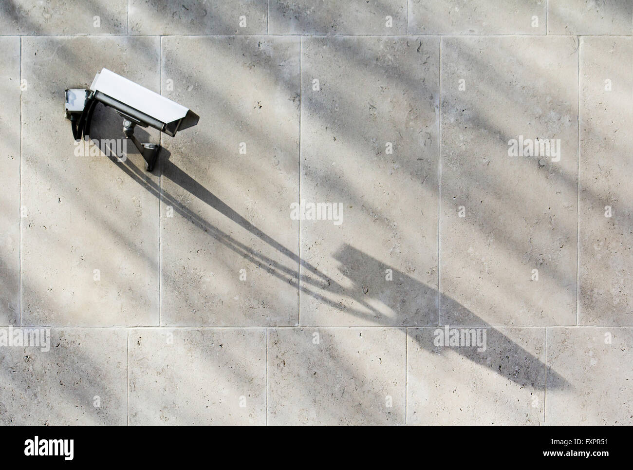 CCTV camera shadow on wall Stock Photo - Alamy
