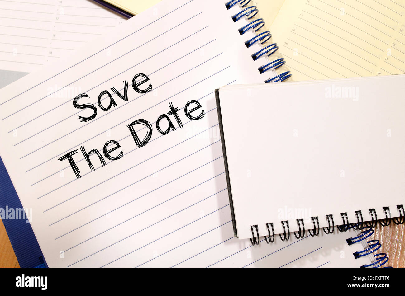 Save the date text concept write on notebook Stock Photo - Alamy