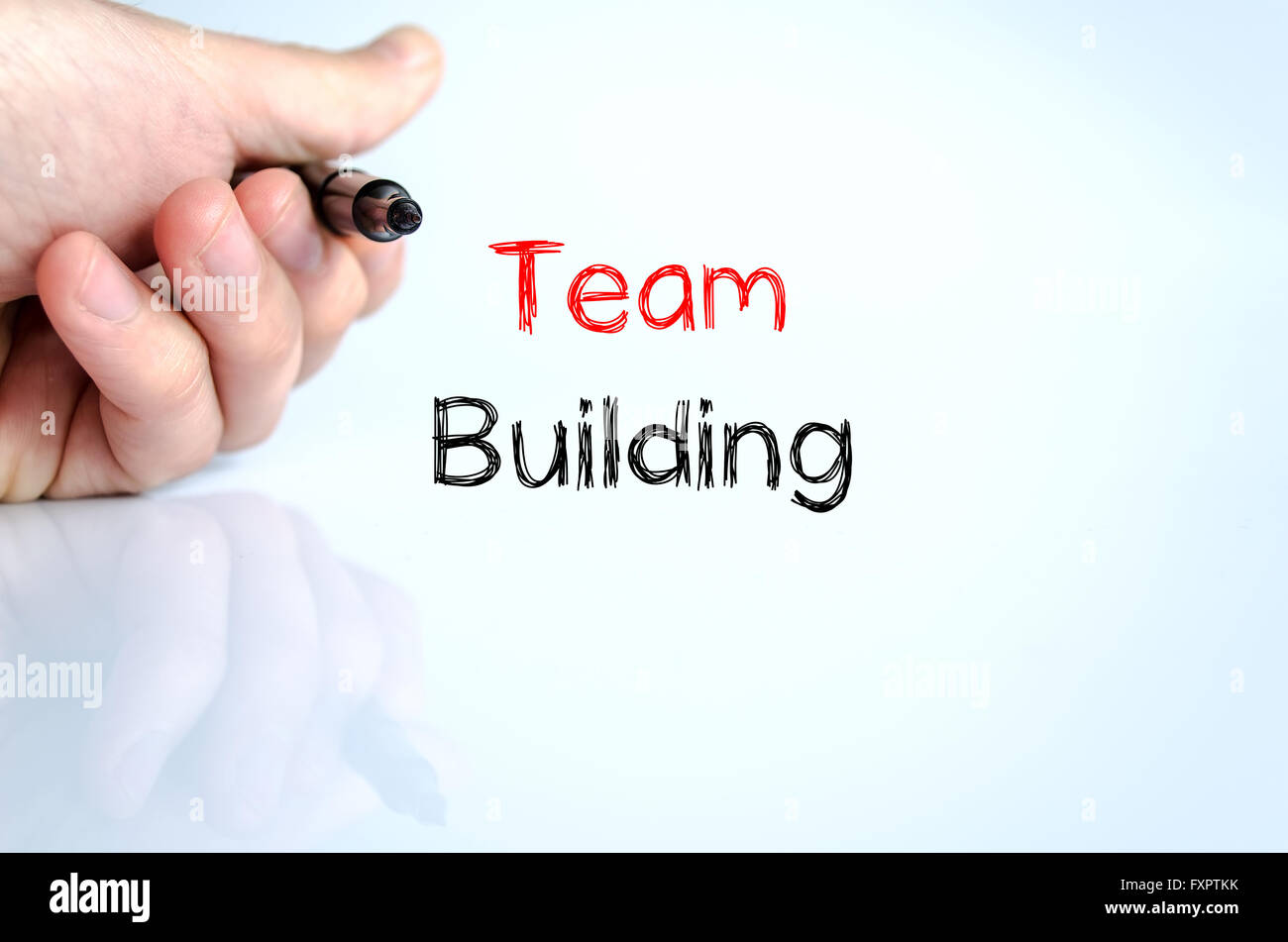 Team building note in business man hand Stock Photo - Alamy