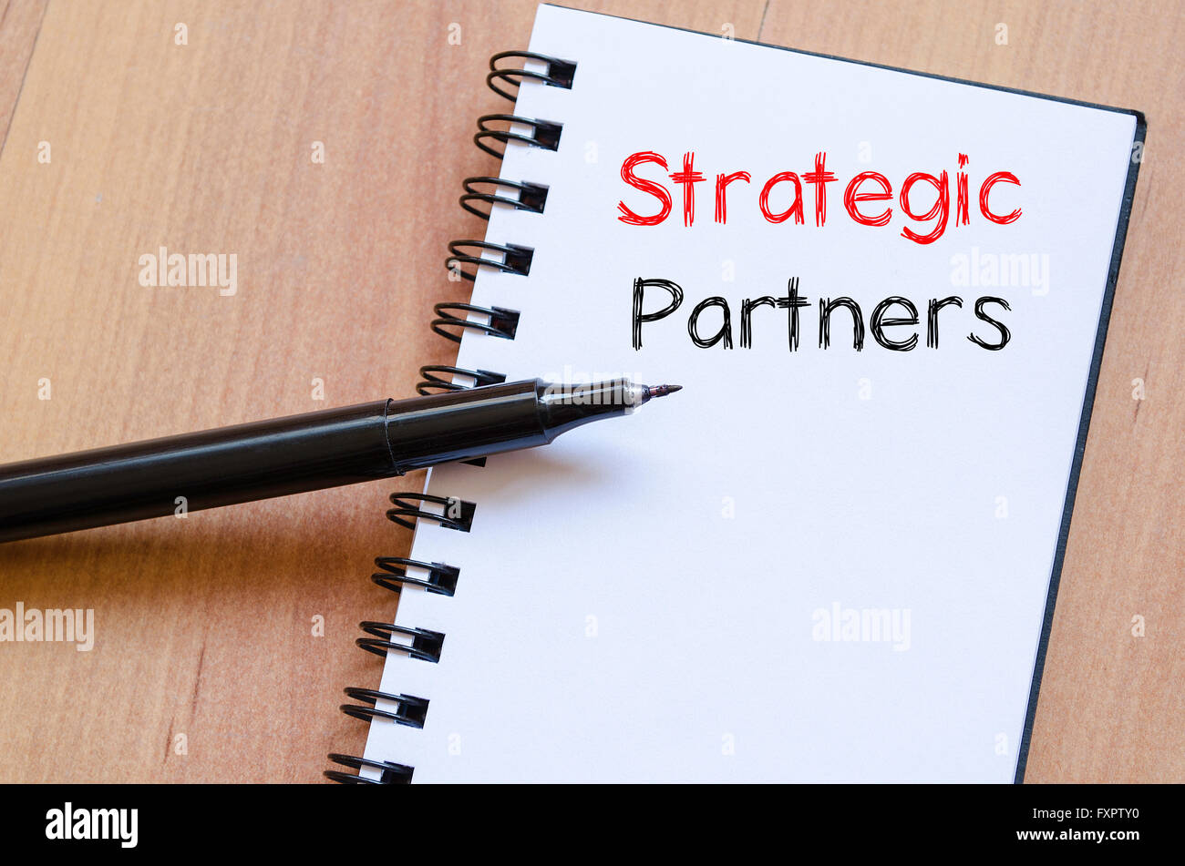 Strategic partners text concept write on notebook Stock Photo - Alamy