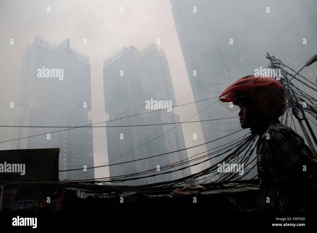Jakarta, Indonesia. 17th Apr, 2016. A man watch a fire during ...