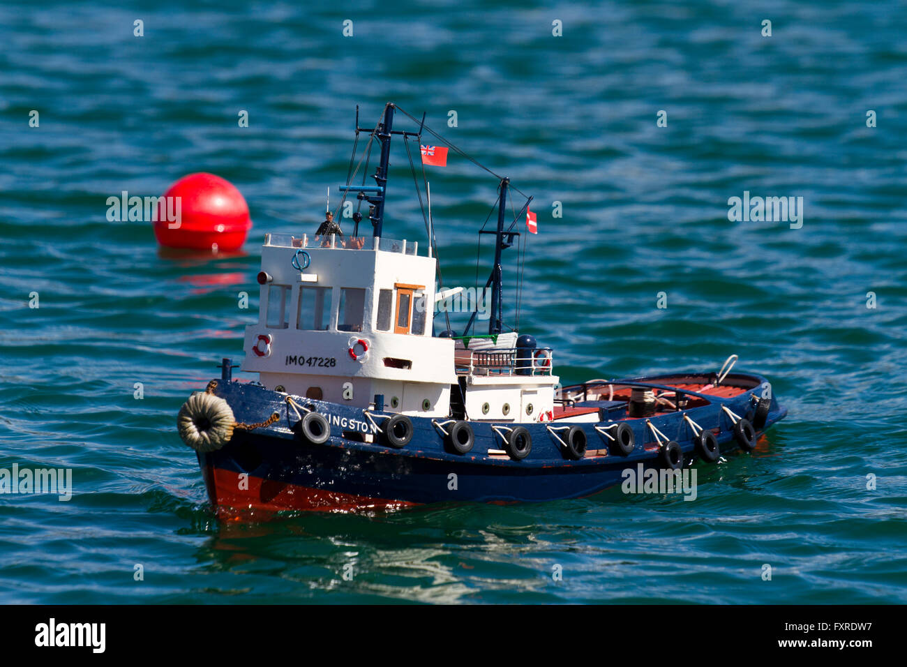 A remote controlled model boat on a dedicated lake on New Brighton sea ...