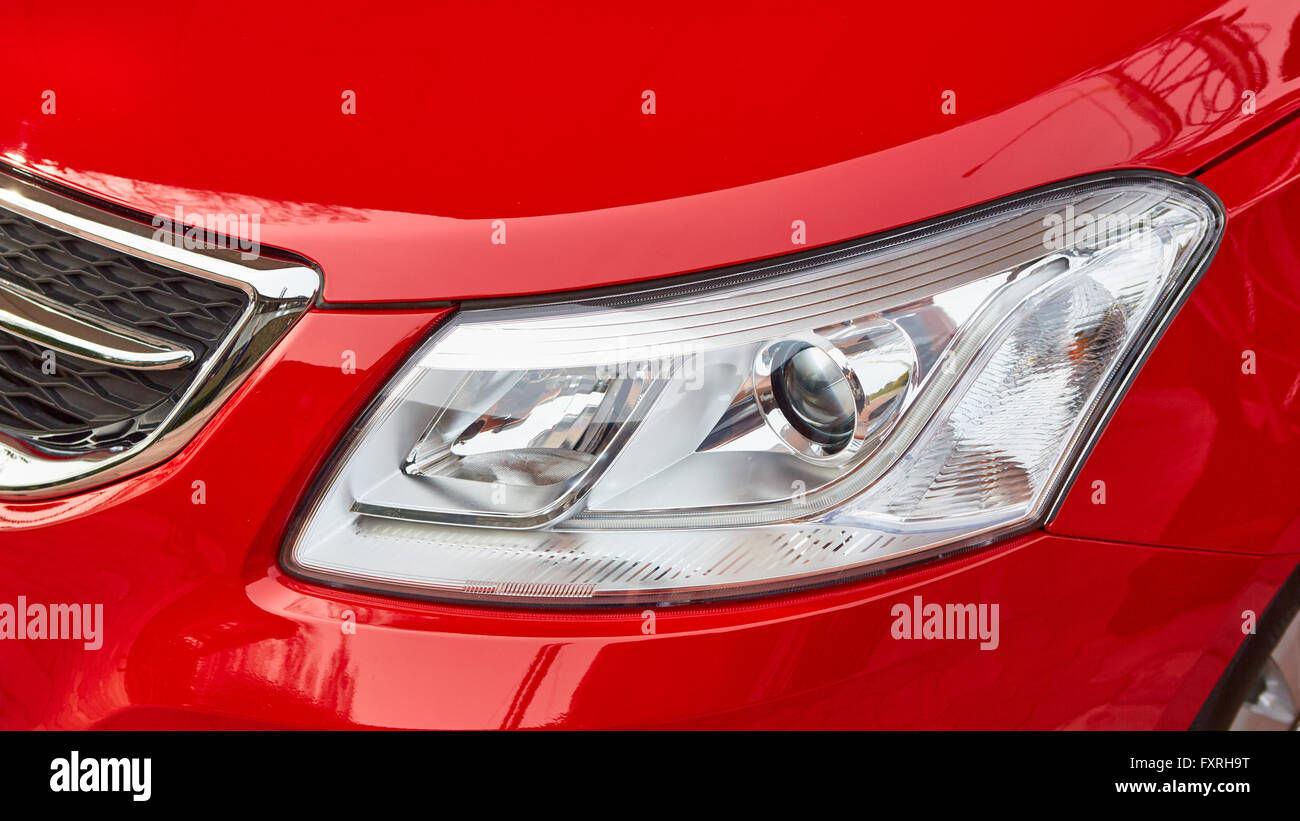 Headlight on modern red car on outdoor Stock Photo - Alamy