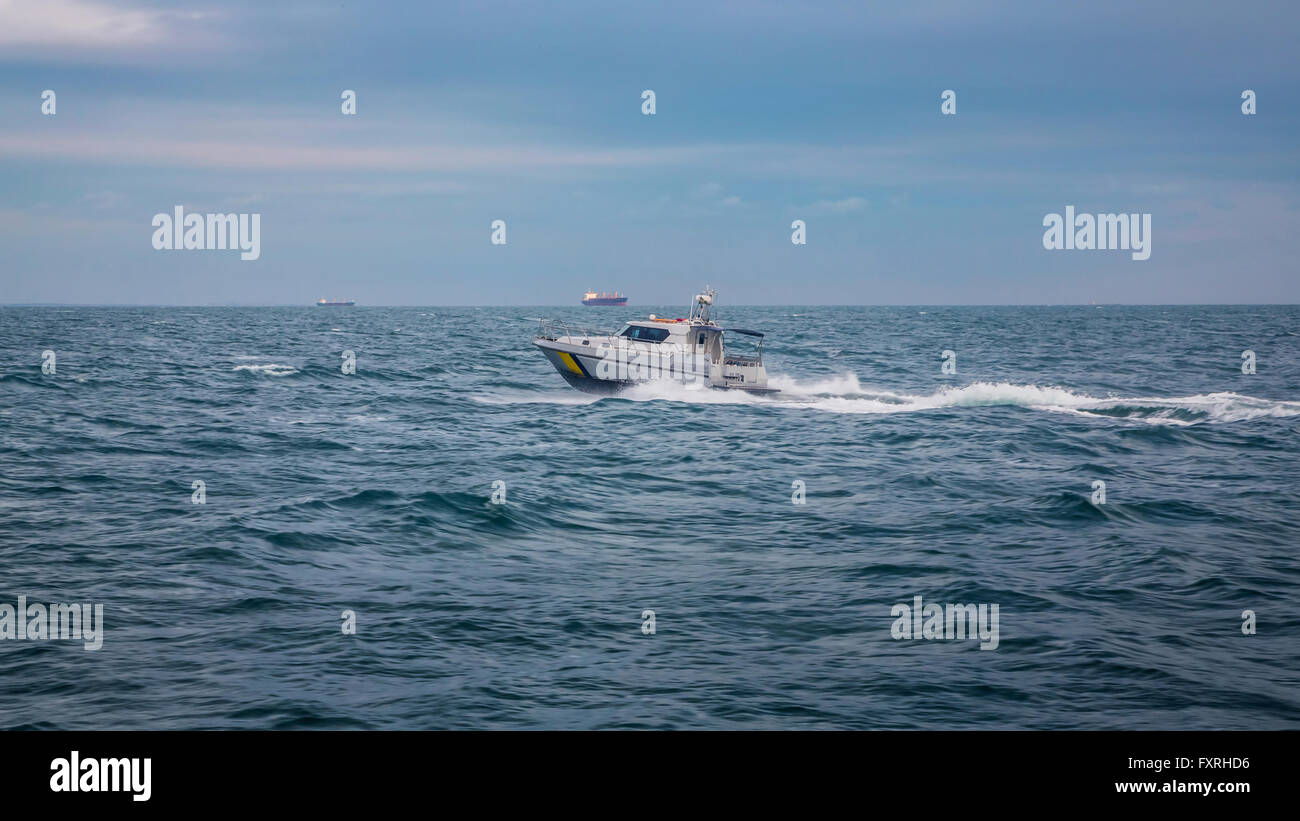 boat floating on waves of the sea Stock Photo - Alamy
