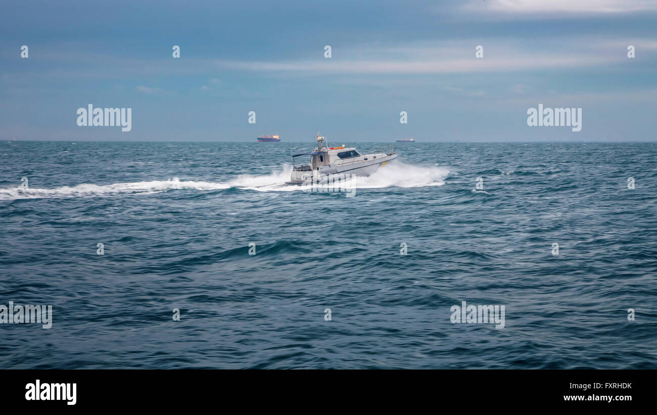 boat floating on waves of the sea Stock Photo - Alamy