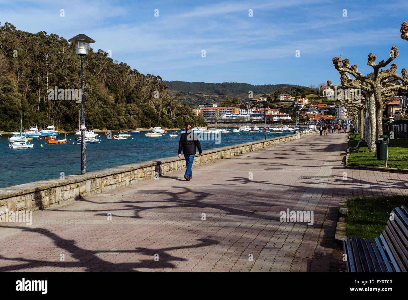 People walking along the promenade of Plentzia, Bilbao, Basque Country ...