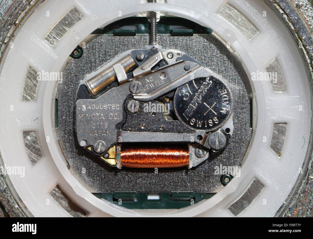 Macro image of electronic watch mechanism internal view battery cell ...