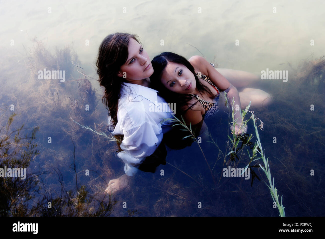 Two women sitting close hi-res stock photography and images - Alamy