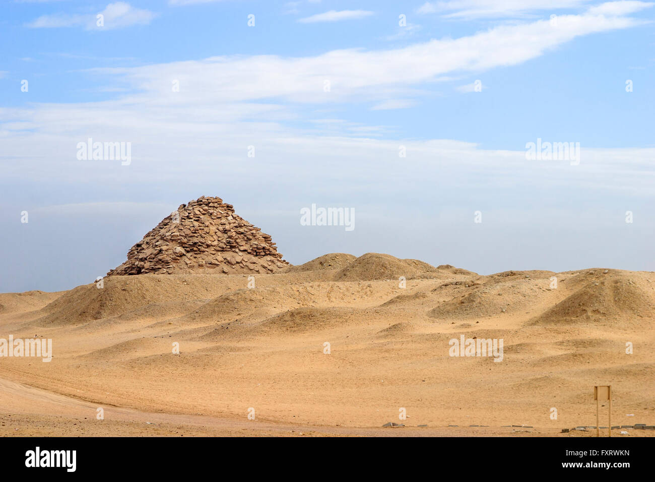 View of a crumbling pyramid in the desert at Sakkara, ancient ...