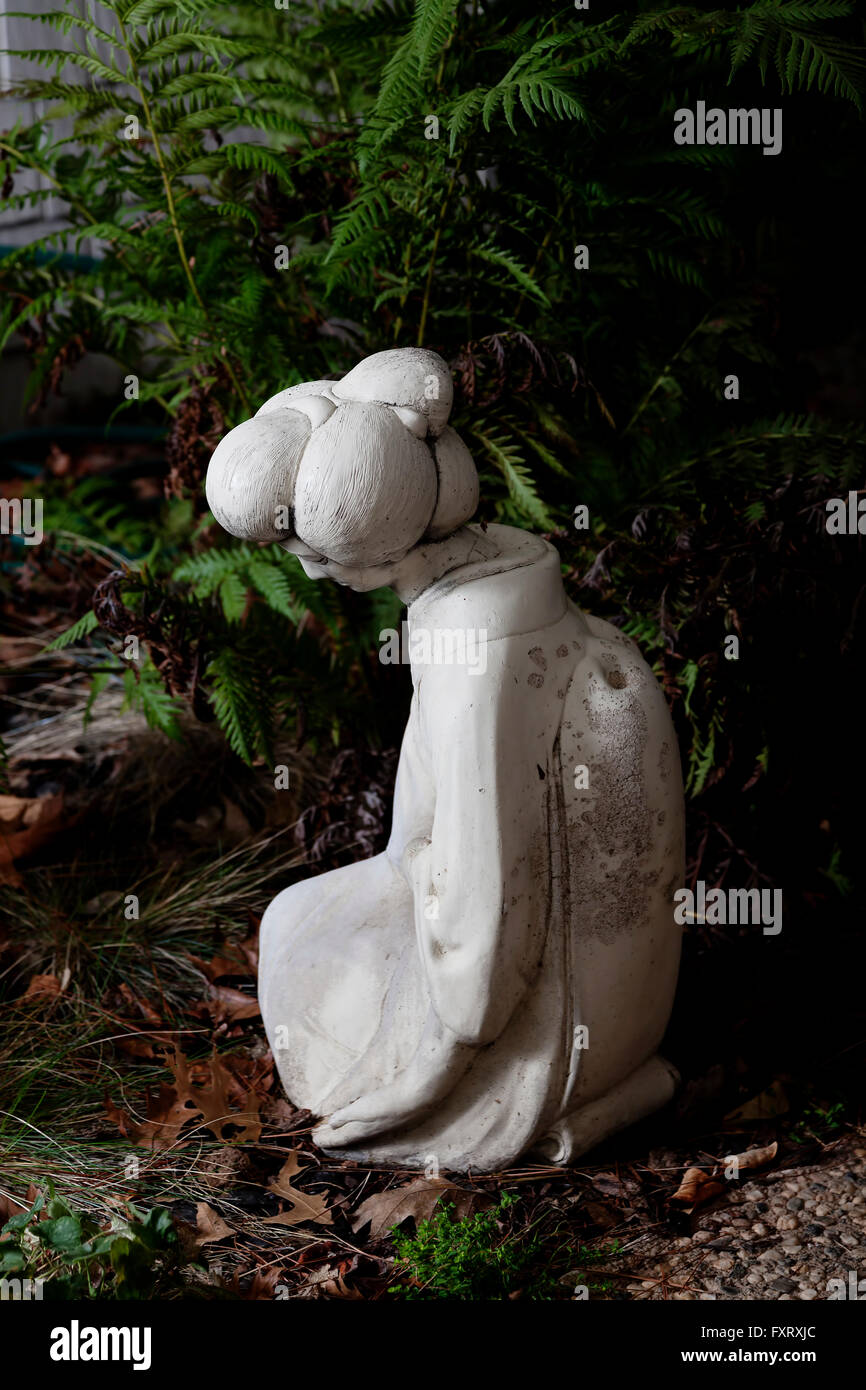 White Cement Statue Of Japanese Sitting Woman In Small Garden Stock ...