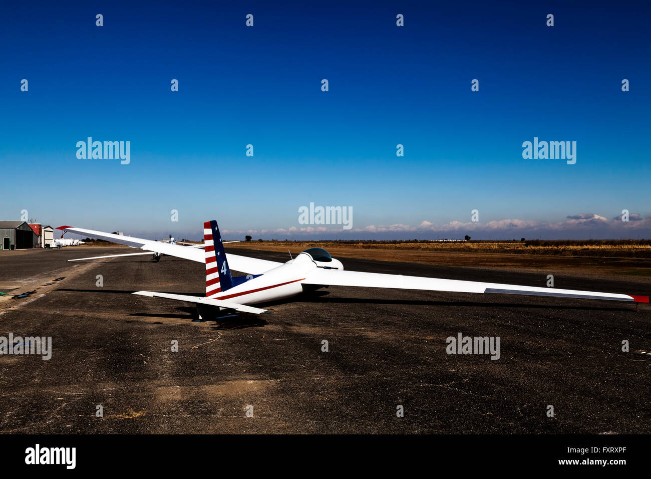 Glider From Behind Sitting On Runway Of Airport Stock Photo - Alamy