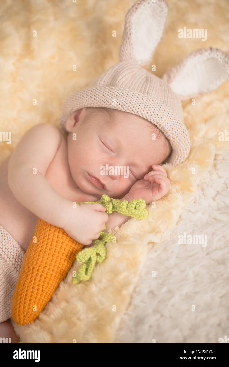 Infant boy in rabbit costume Stock Photo - Alamy