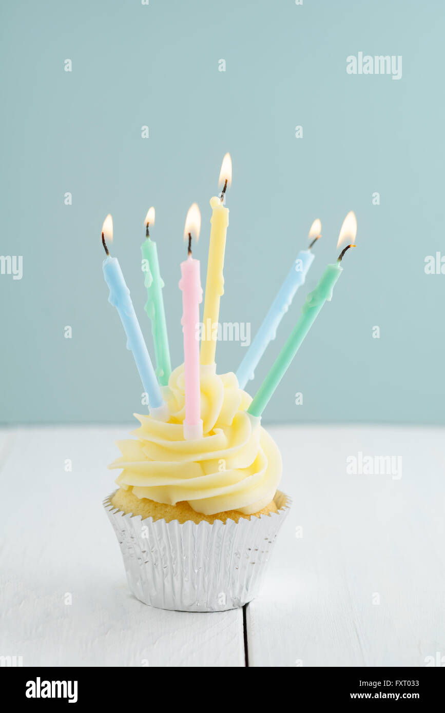Cupcake with candles Stock Photo - Alamy