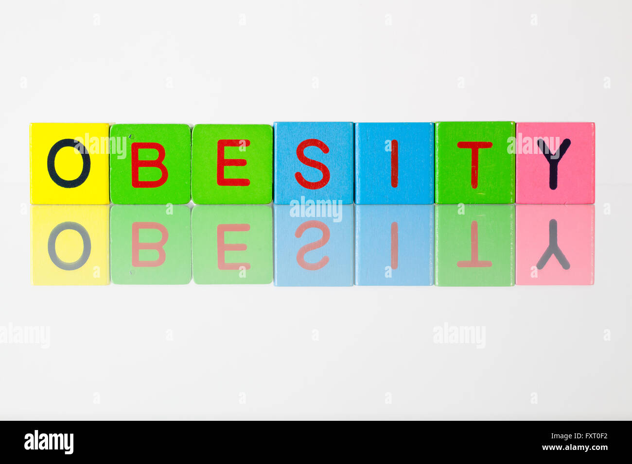 Obesity - an inscription from children's wooden blocks Stock Photo - Alamy