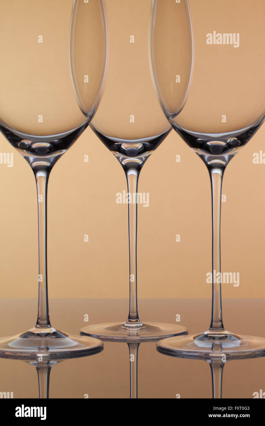 Three empty glasses of wine on a clean background Stock Photo - Alamy
