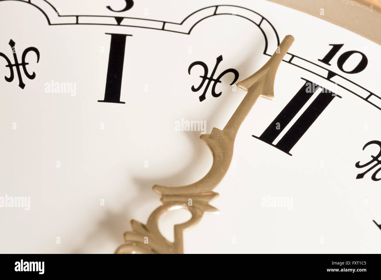 Clock Hand Close Up with Roman Numerals Stock Photo - Alamy