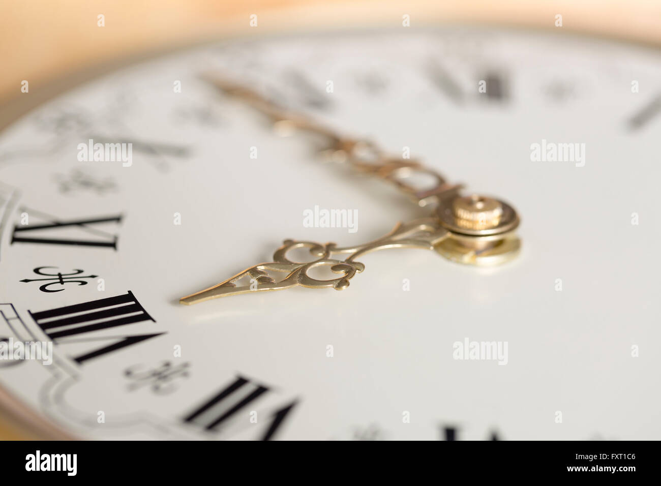 Golden hands clock hi-res stock photography and images - Alamy