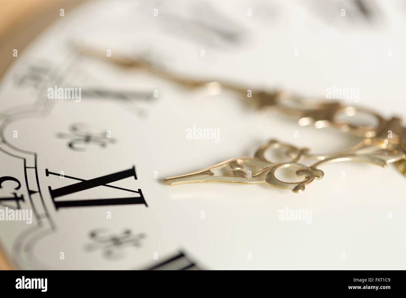 Clock Close Up with Golden Coloured Hands Stock Photo - Alamy