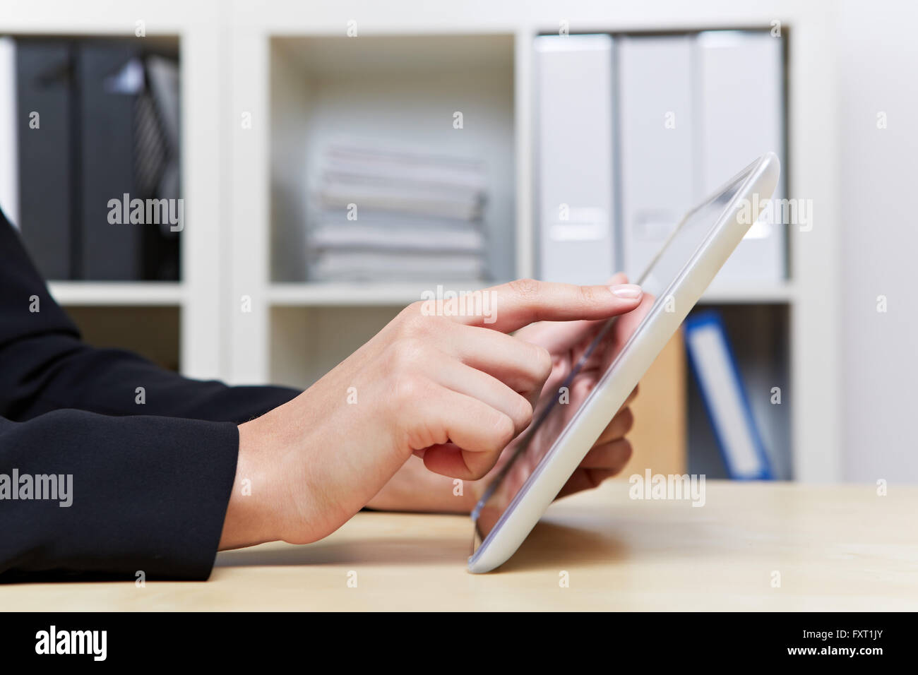 Two hands holding tablet PC in the office on a desk Stock Photo - Alamy