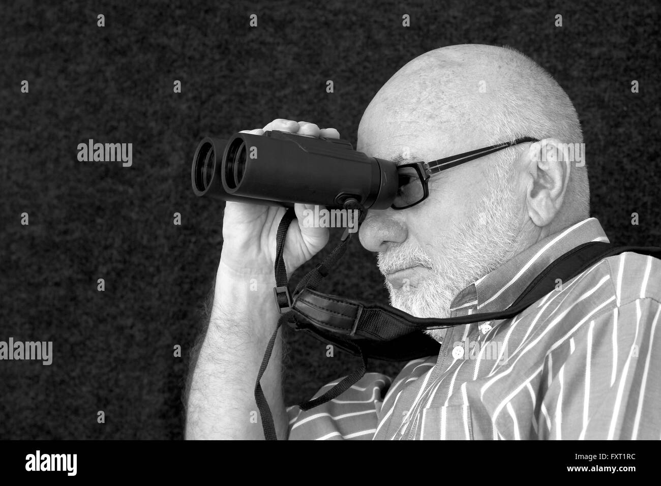 Older gentleman looking through binoculars hi-res stock photography and ...