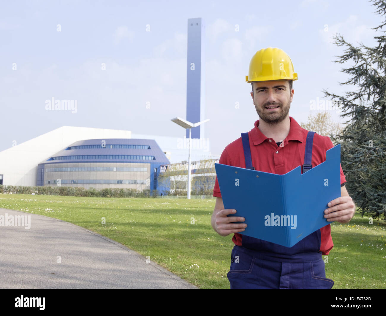 worker outside a factory working and making an inspection Stock Photo ...