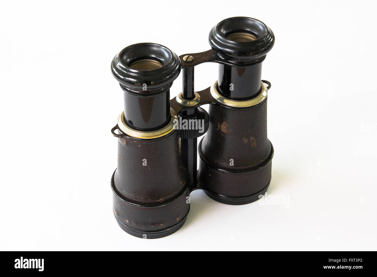 Antique binocular standing on a white surface Stock Photo - Alamy