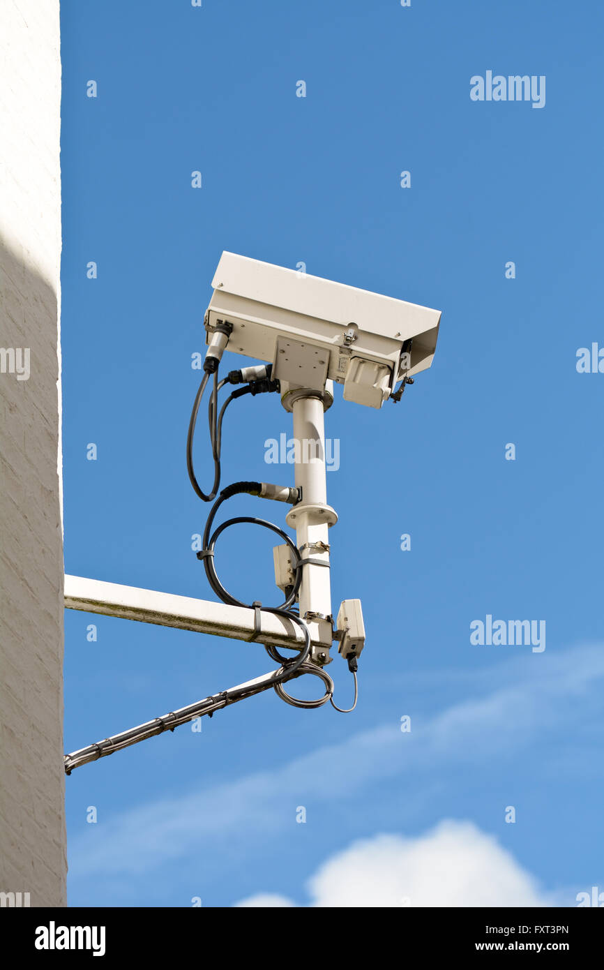 Closed Circuit Television Camera (CCTV) above a High Street in England ...