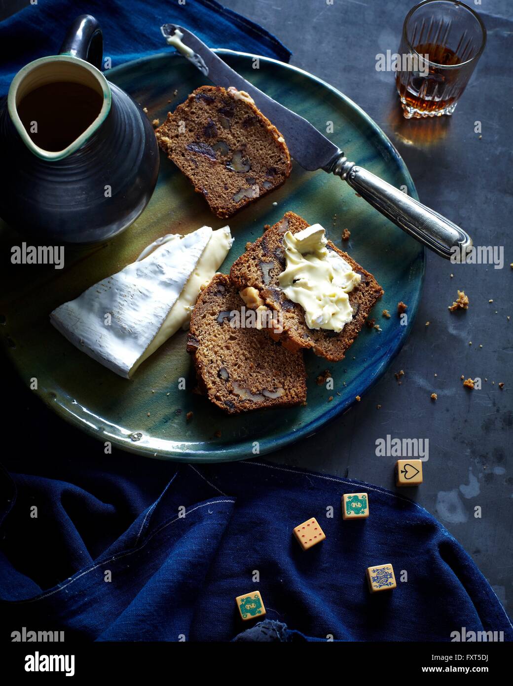 Overhead view of date and walnut loaf slice with fresh brie Stock Photo ...