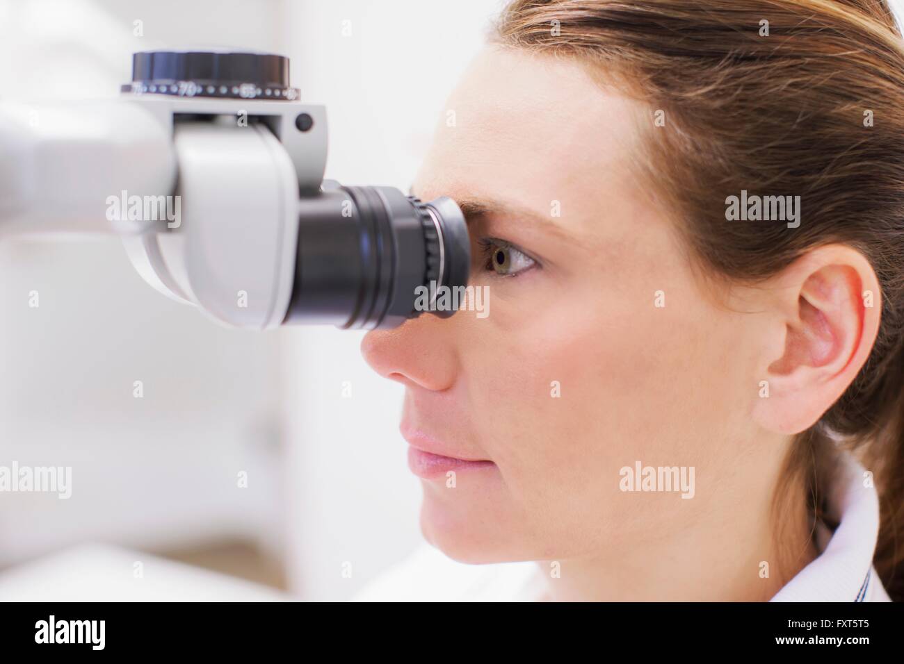 Looking through microscope hi-res stock photography and images - Alamy